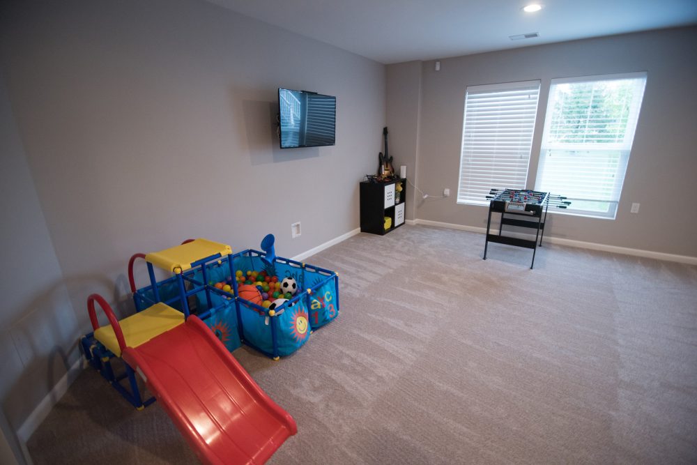 Clarkston, MI Finished Basement with Rock Wall - Basements Plus