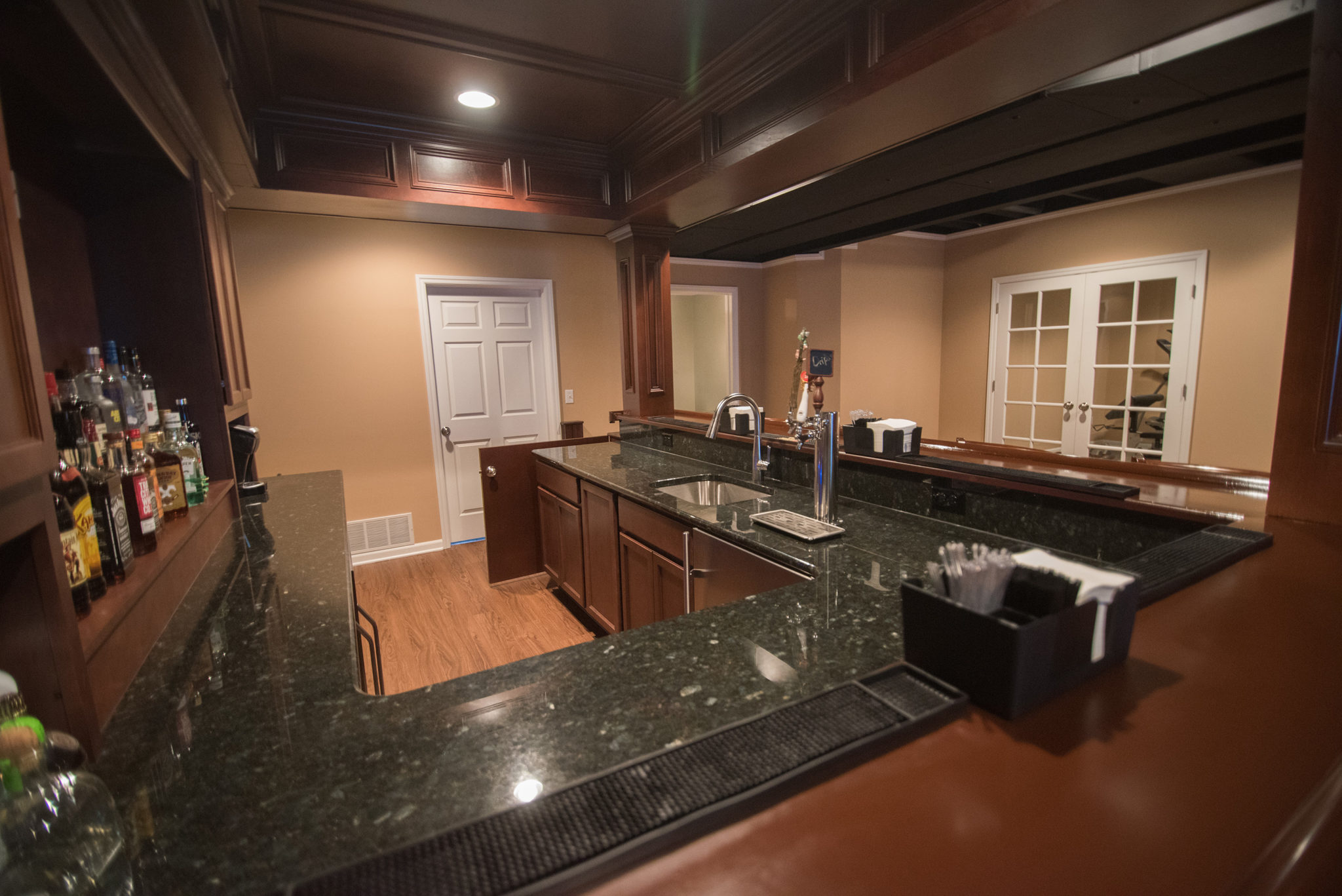 Utica, MI Finished Basement with Pub Style Bar - Basements Plus