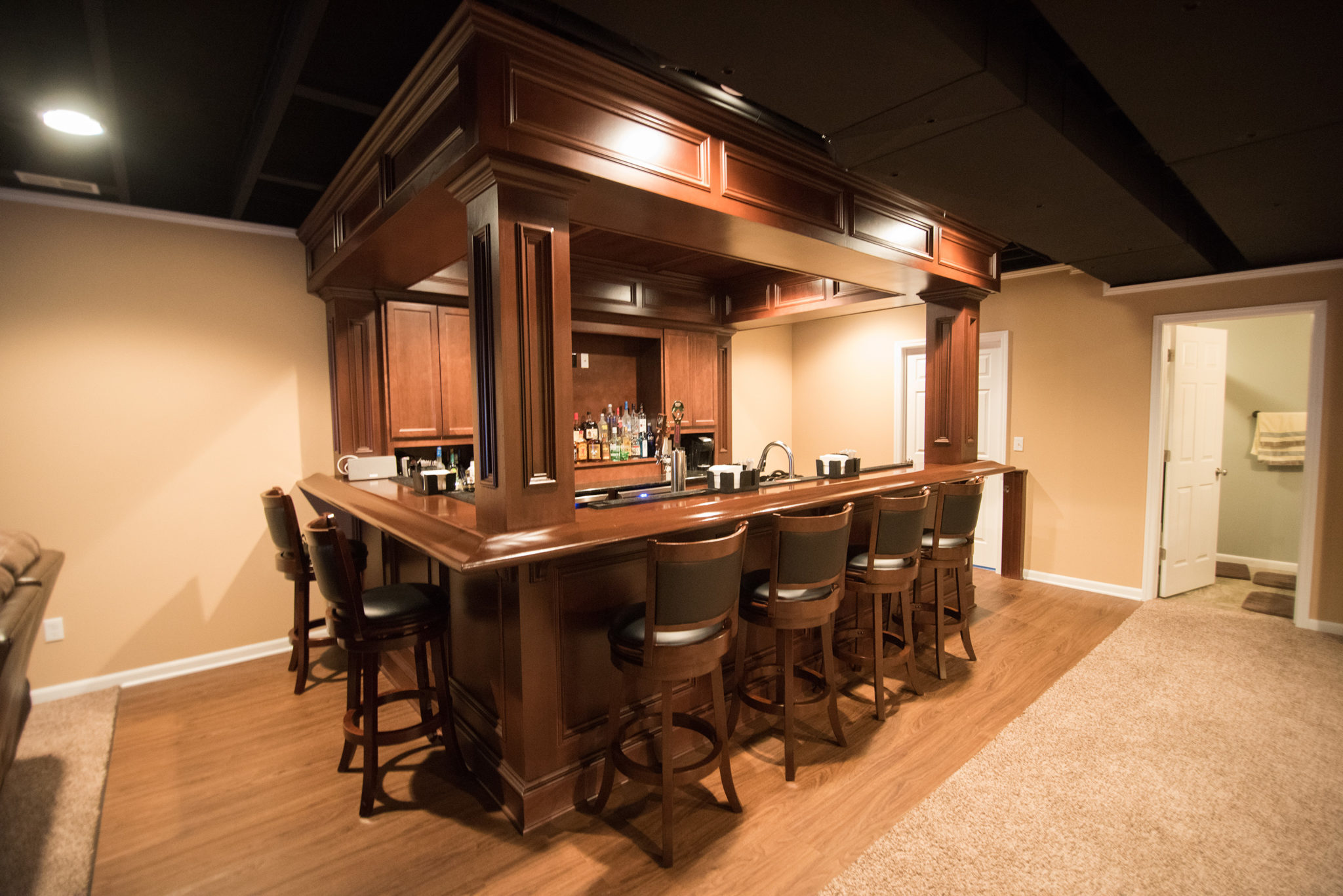 Utica, MI Finished Basement with Pub Style Bar - Basements Plus